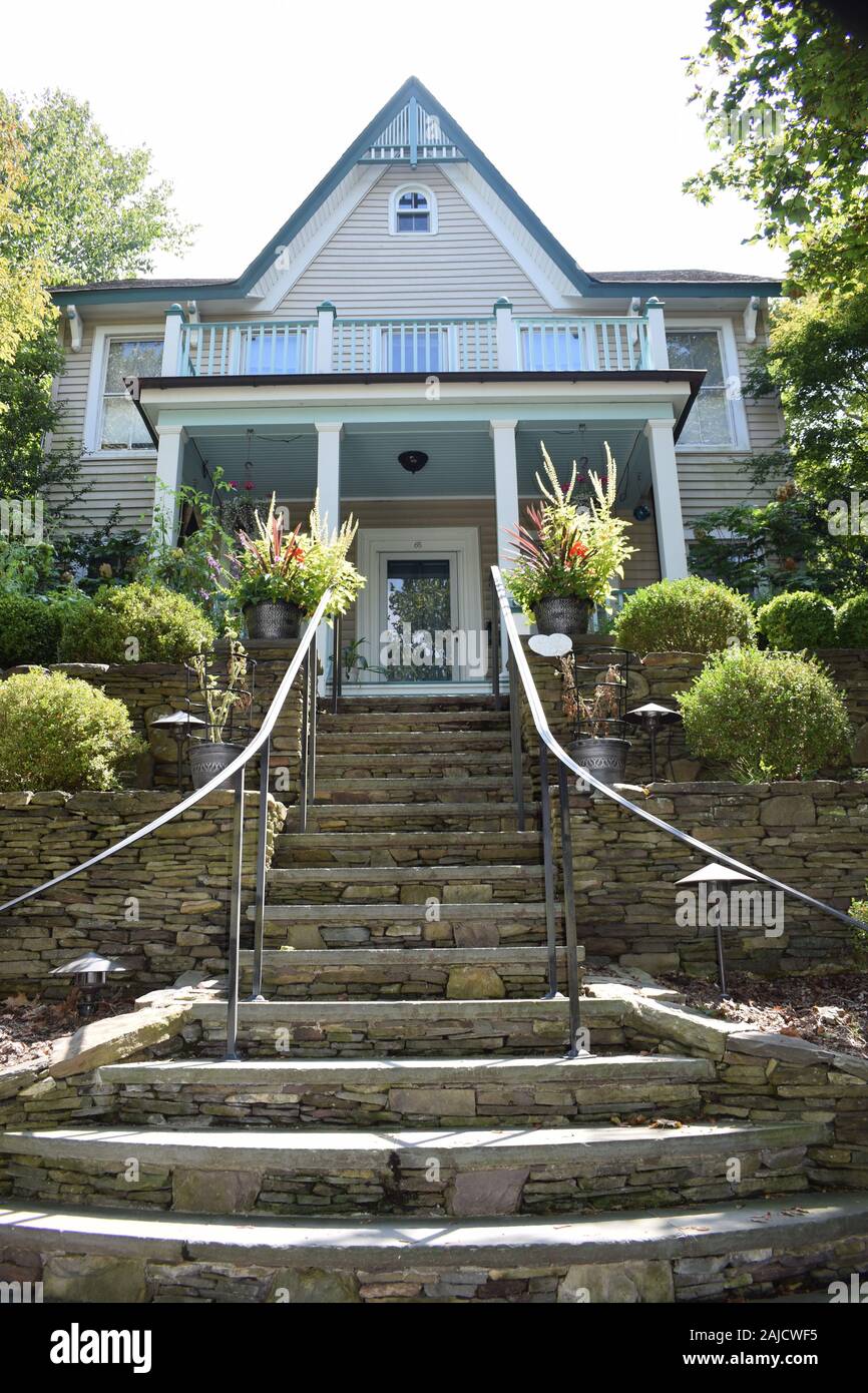 Stone steps flanked by shrubs leading to grand house Stock Photo - Alamy