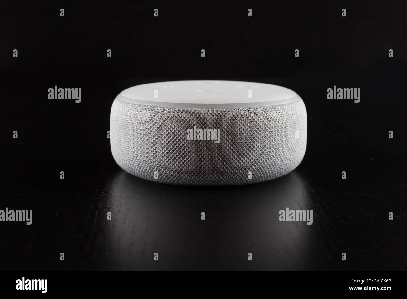white digital voice assistant on a black background Stock Photo - Alamy
