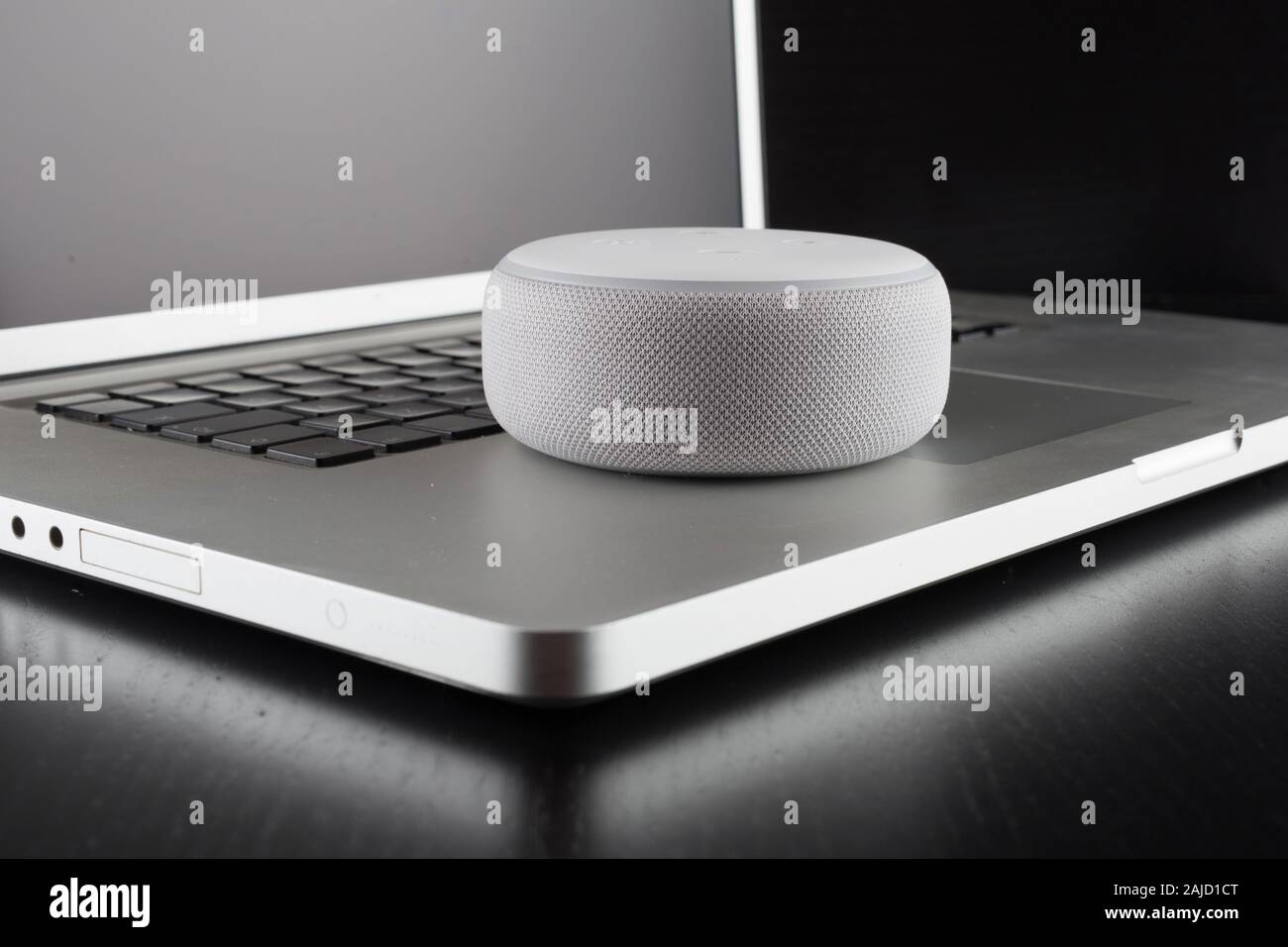 white digital voice assistant with computer on a black background Stock ...