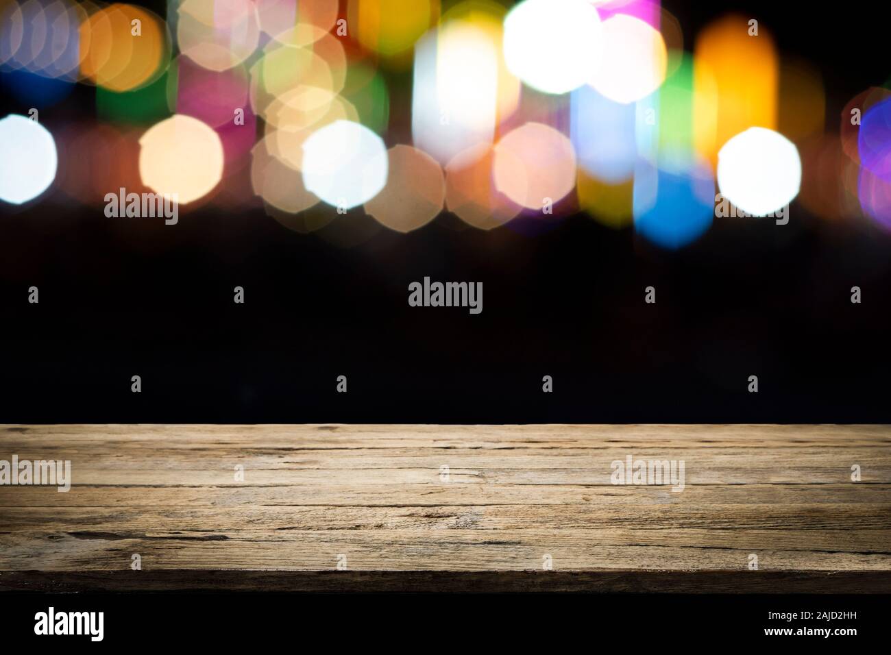 Empty wooden table platform and bokeh at night Stock Photo - Alamy