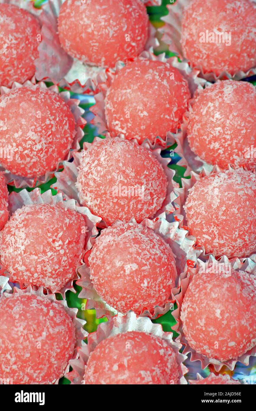 A bunch of pink sweet ball candies Stock Photo - Alamy