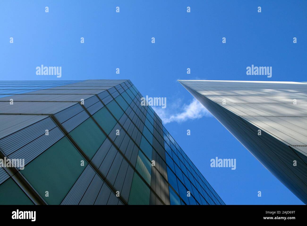 Geometric formation of two grey business buildings Stock Photo - Alamy