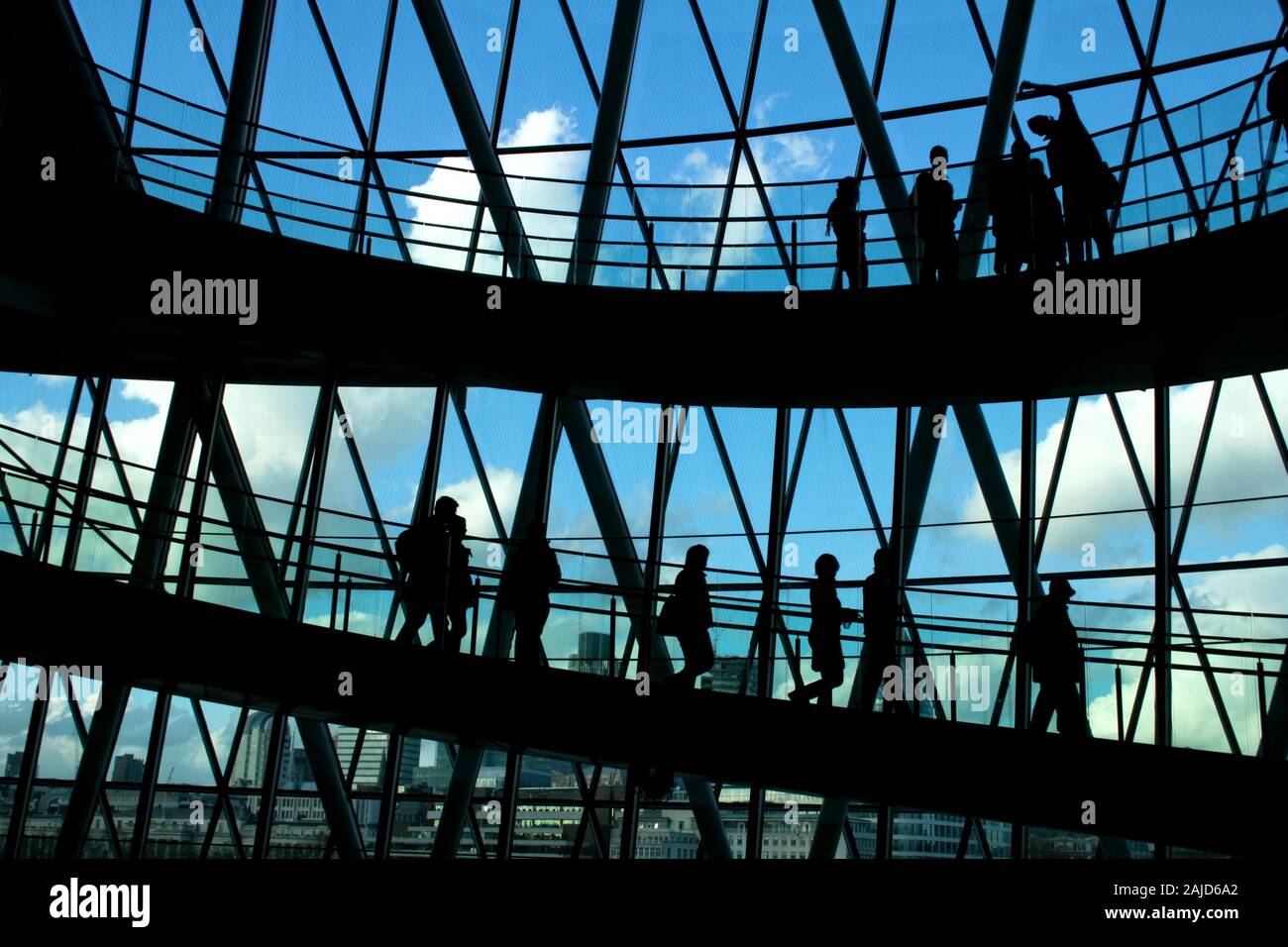 Silhouettes of people in front of big window Stock Photo - Alamy