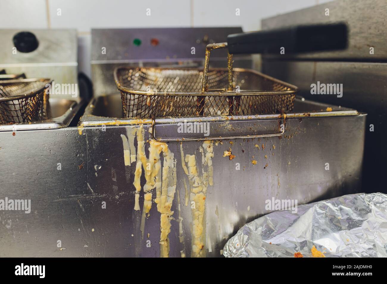 Deep fryer with oil on restaurant kitchen Stock Photo - Alamy