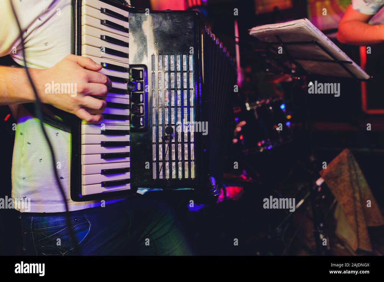 Image of musician playing on accordion closeup Stock Photo - Alamy