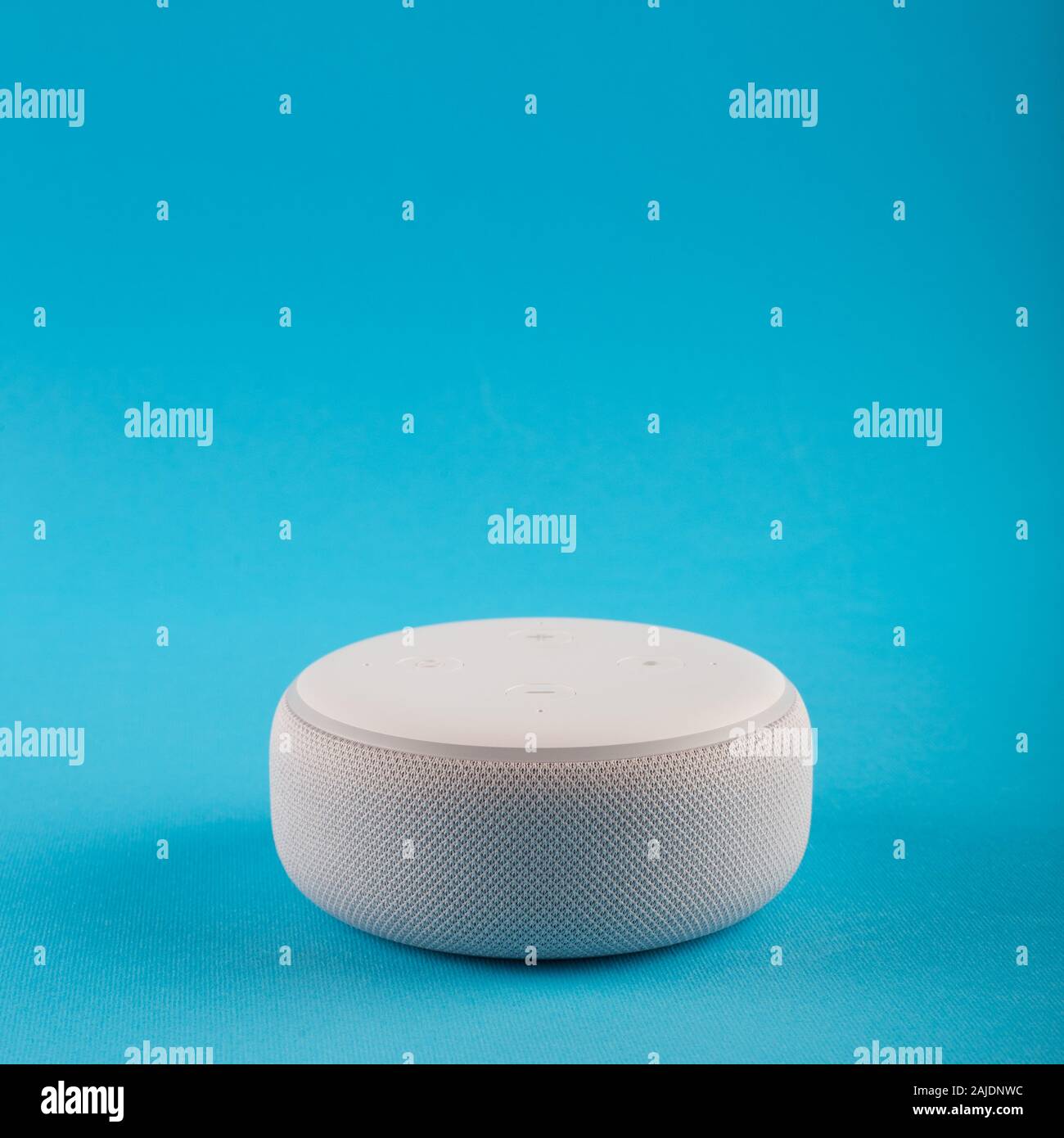 white digital voice assistant on light blue background Stock Photo - Alamy