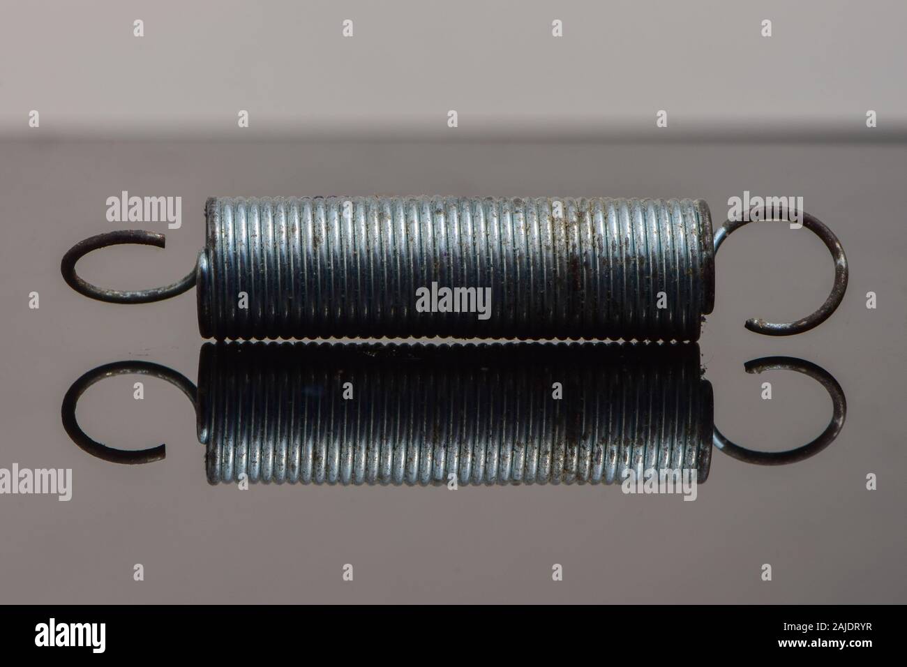 Metal spring reflection image Stock Photo - Alamy
