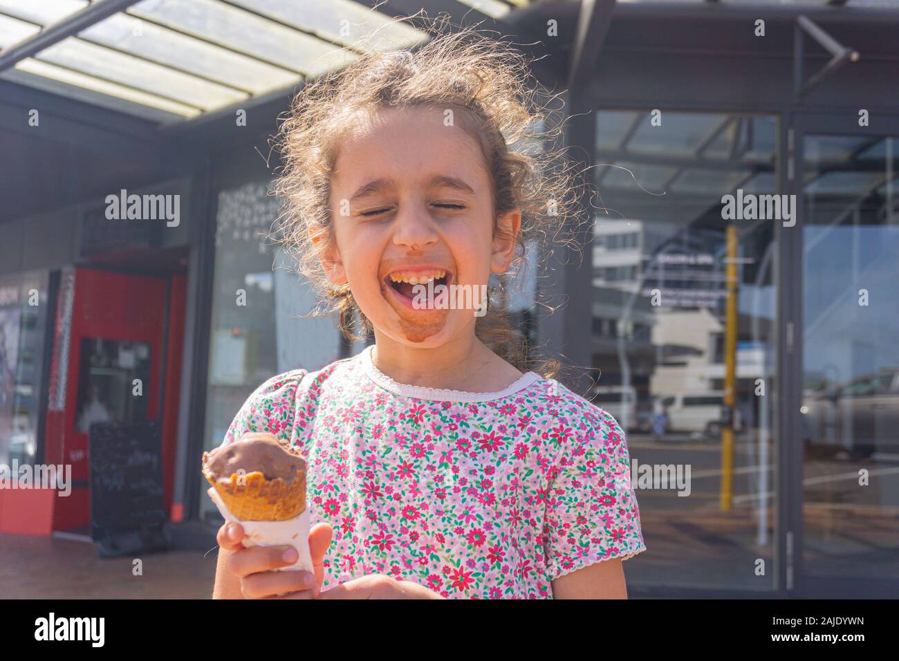 Child with chocolate around their mouth hi-res stock photography and ...