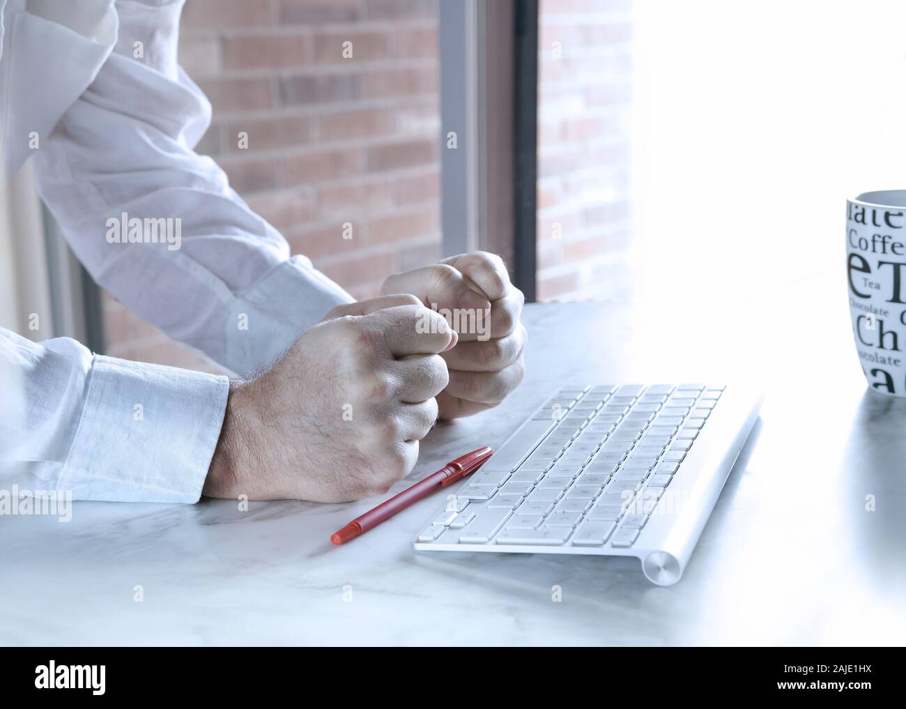 Clenched hands hi-res stock photography and images - Alamy