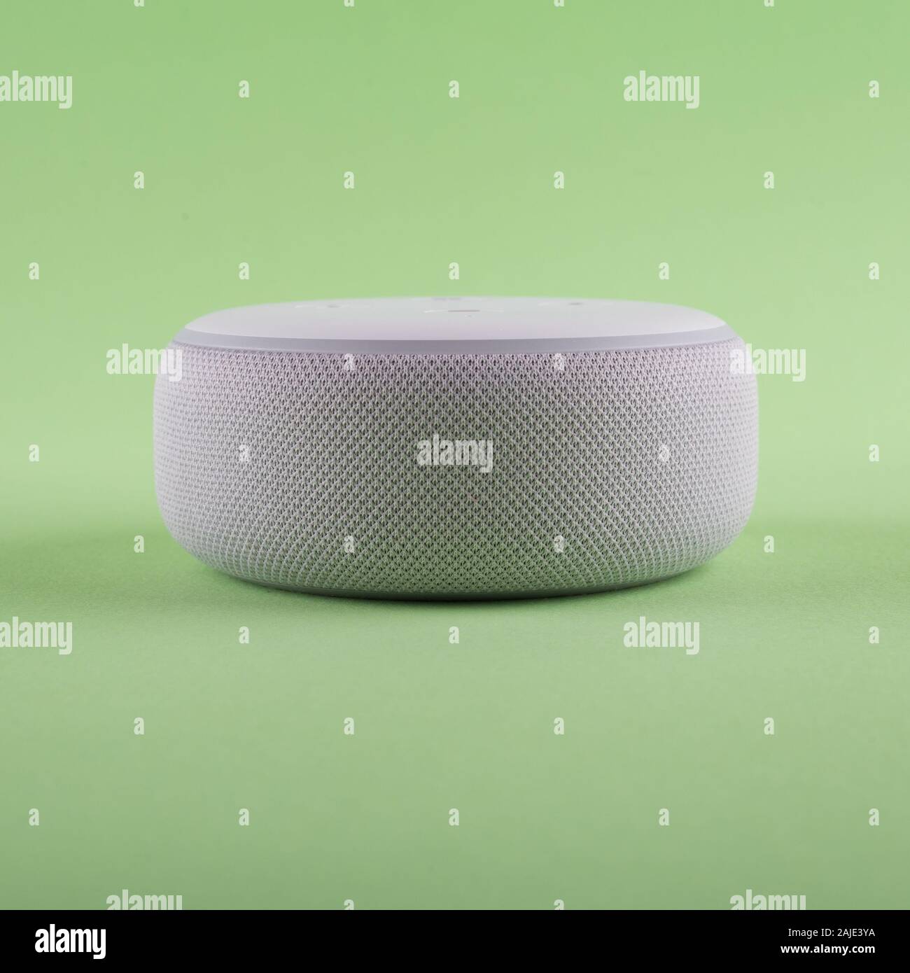 white digital voice assistant with green background Stock Photo - Alamy