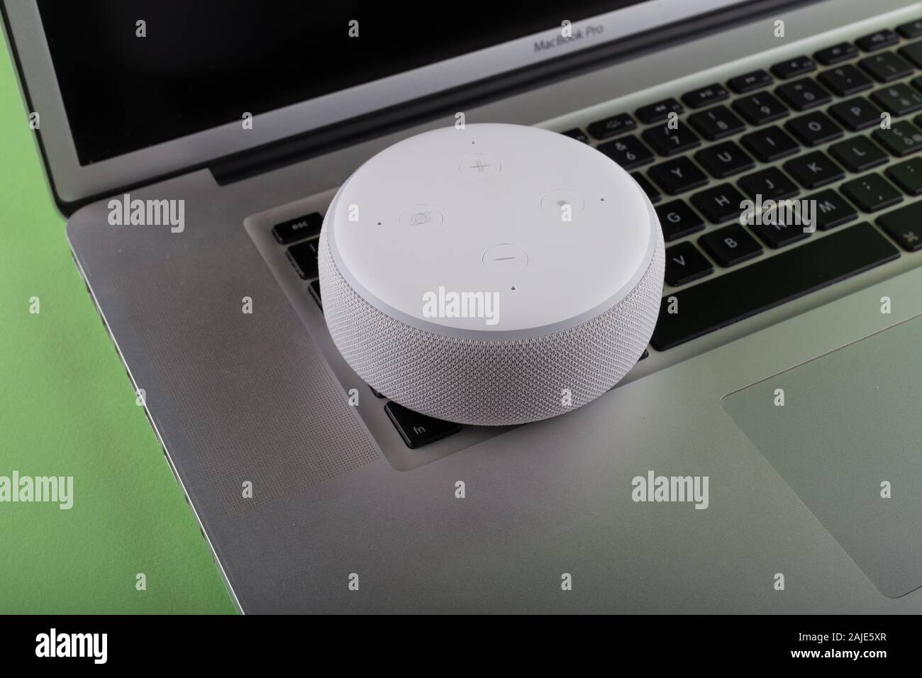 digital voice assistant with computer and green background Stock Photo ...