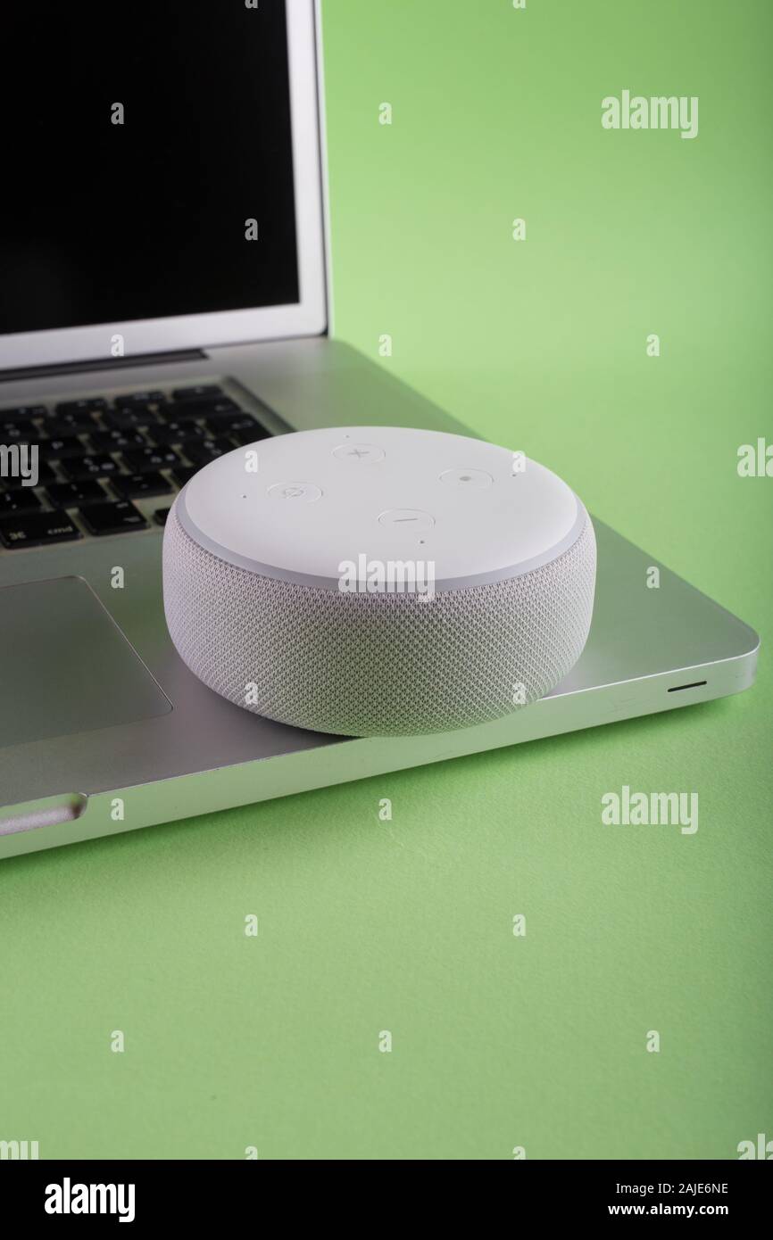 digital voice assistant with computer and green background Stock Photo ...