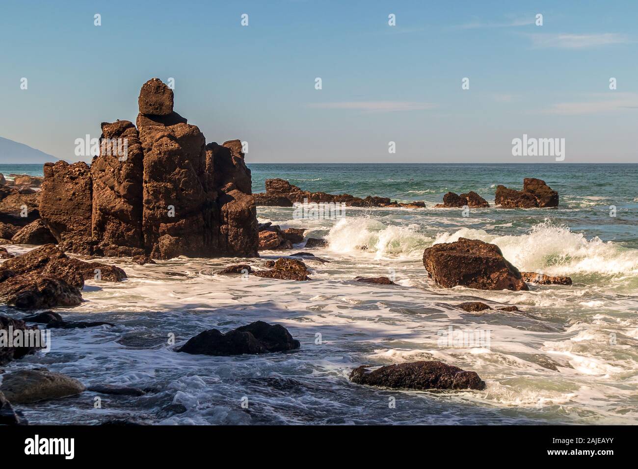 Rocks and surf by the beach shore in Puerto Vallarta, Jalisco, Mexico ...
