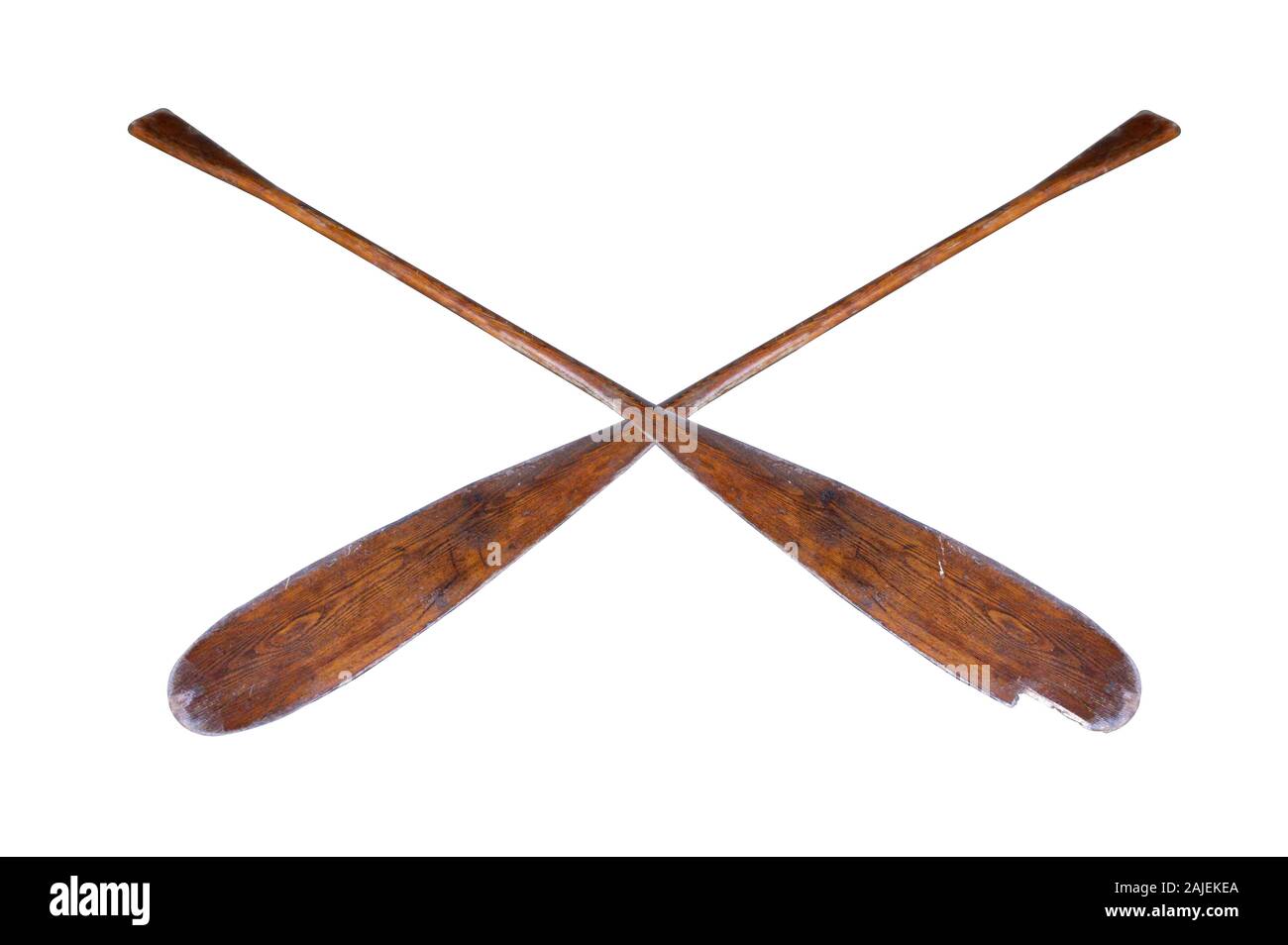 A pair of old, well-used, partially broken oars, isolated on a white ...