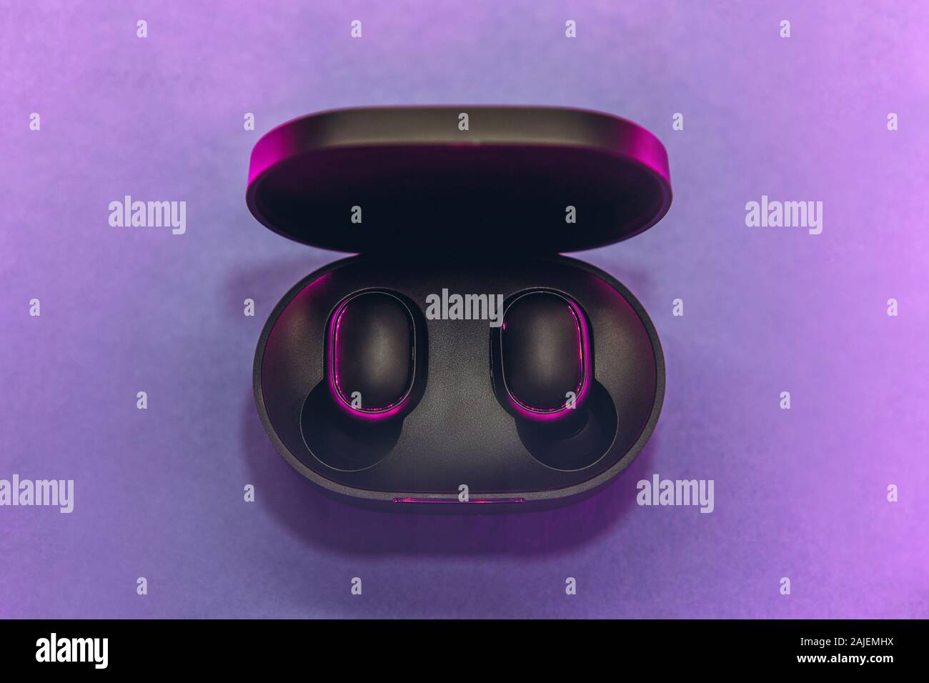 Wireless headphones on a trendy neon color gradient background Stock ...