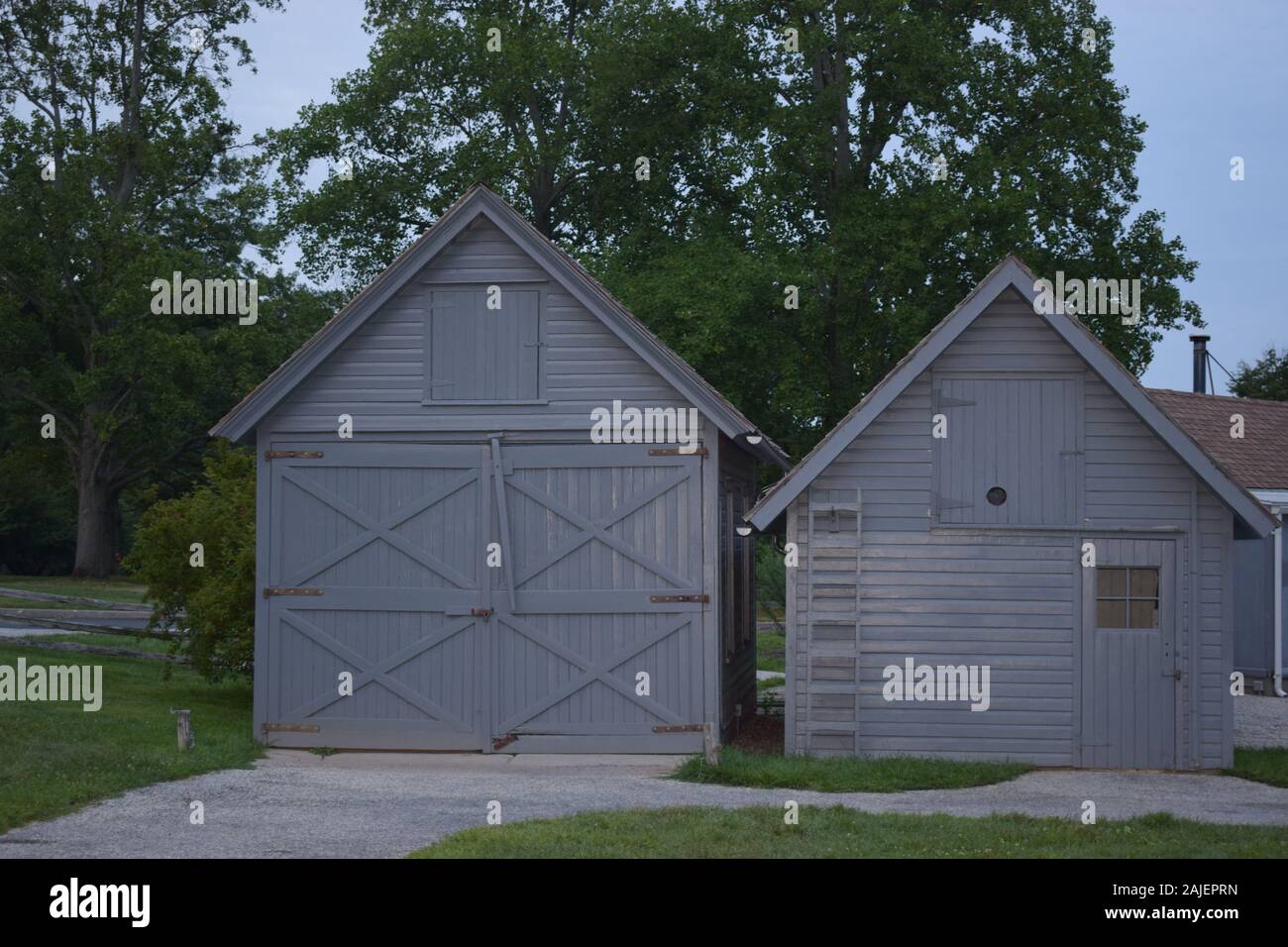 Two gray barns next to each other. Rustic chic Stock Photo - Alamy