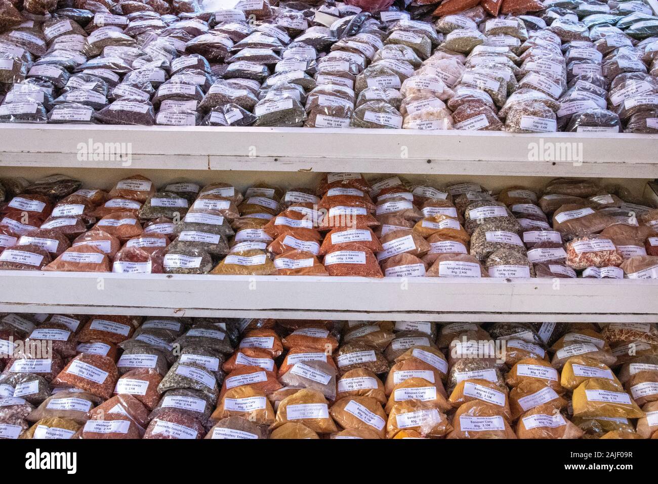 Assorted spices packed and labelled on display at the Naschmarket in ...
