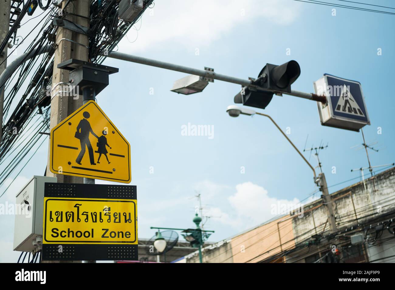 Yellow school zone warning sign at the roadside in Bangkok,Thailand ...