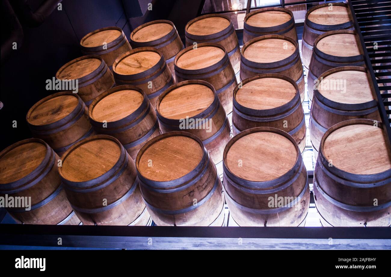 Wooden barrels with wine. Traditional wine storage photo Stock Photo ...