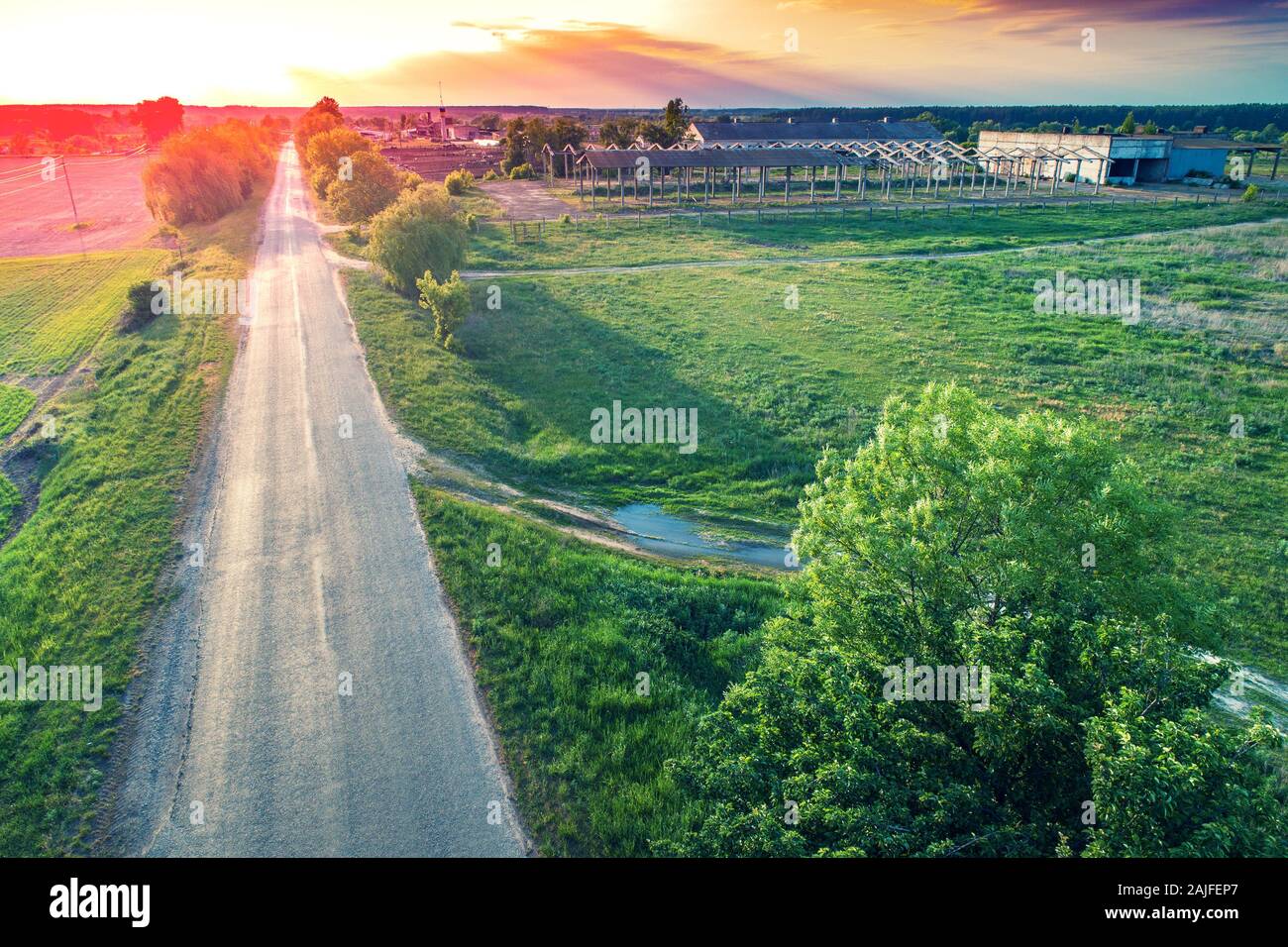 Aerial view of the countryside. The direct country road along the field ...