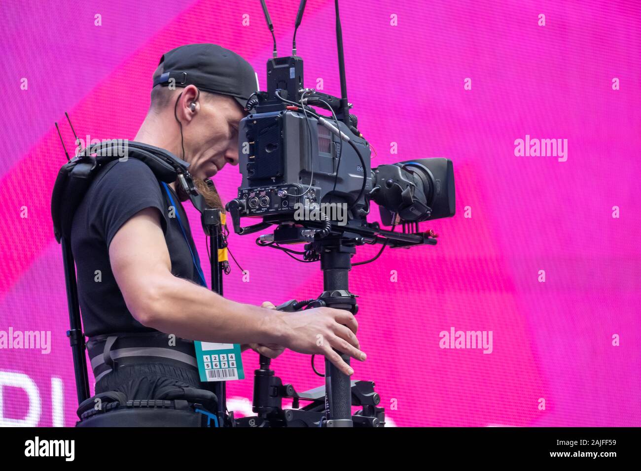 Steadicam camera man online broadcasting from stage Stock Photo - Alamy