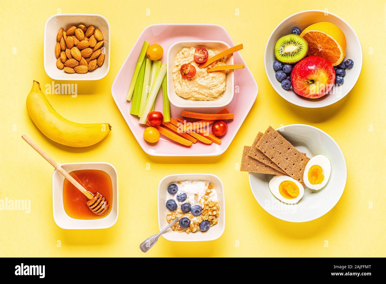 Healthy snack on a pastel background, top view Stock Photo - Alamy