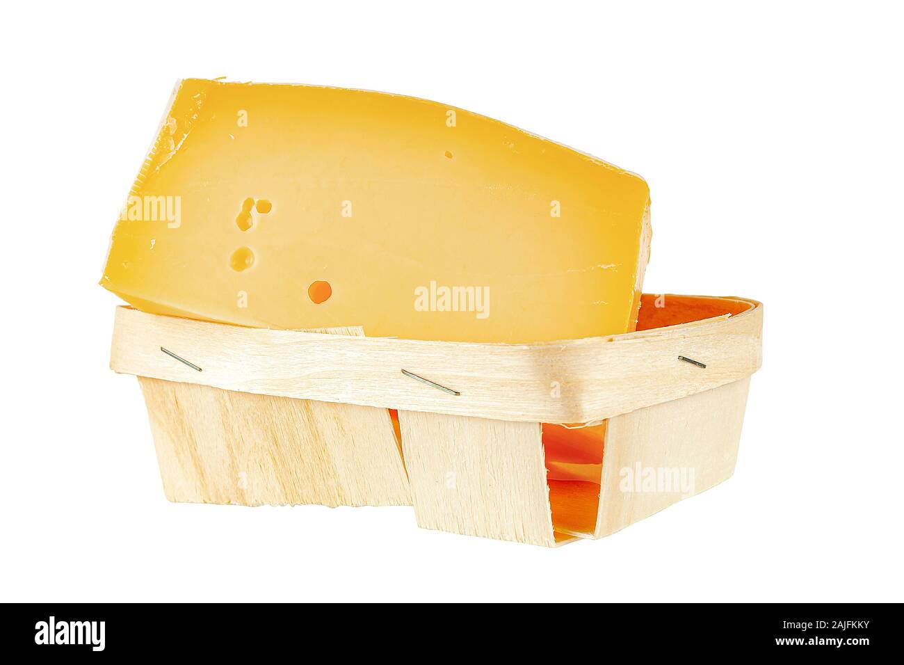 Cheese lies in birch bark packaging on a white background, isolate ...