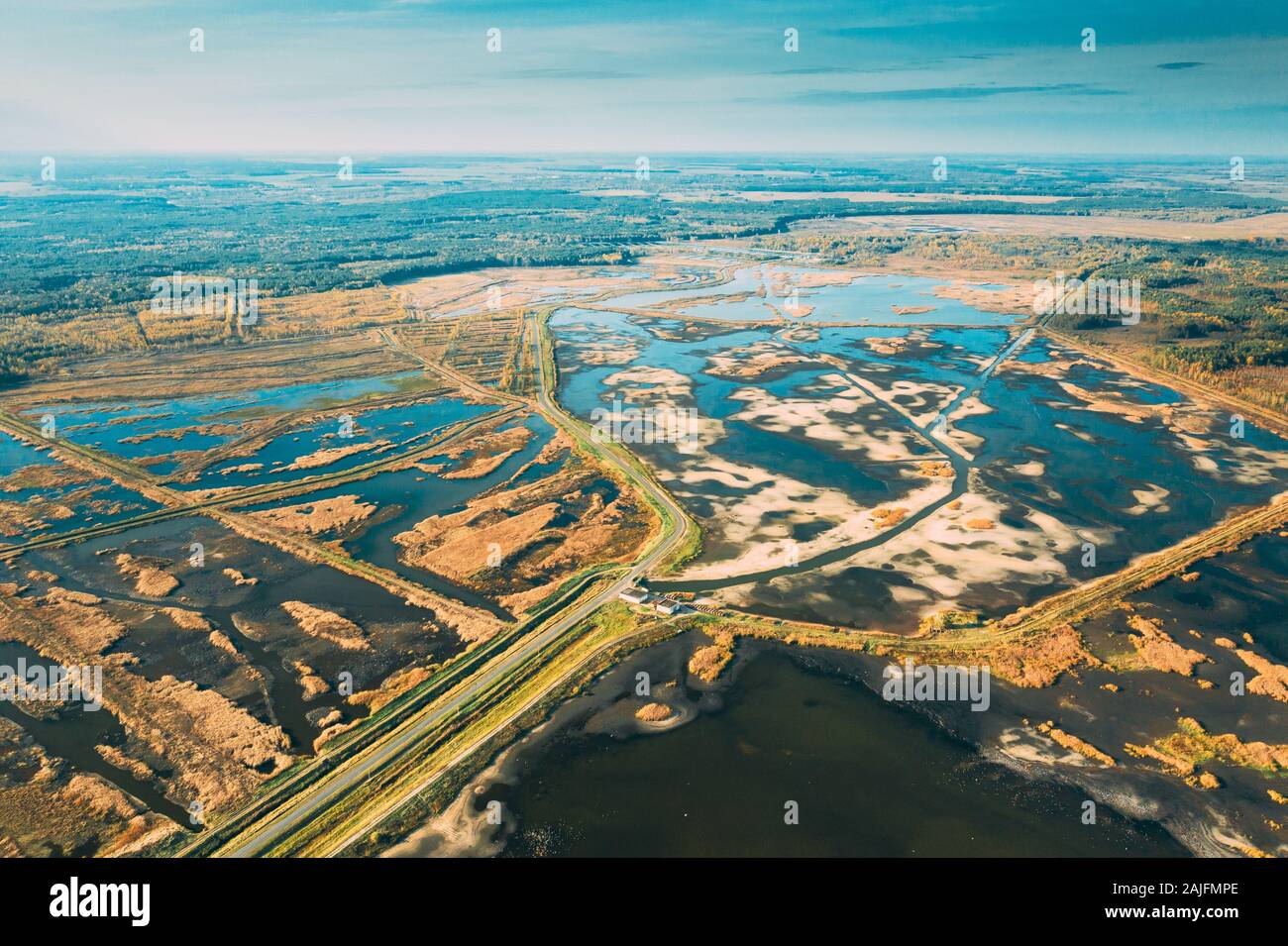 Belarus. Aerial View Of Road Through Ponds In Autumn Landscape. Ponds ...