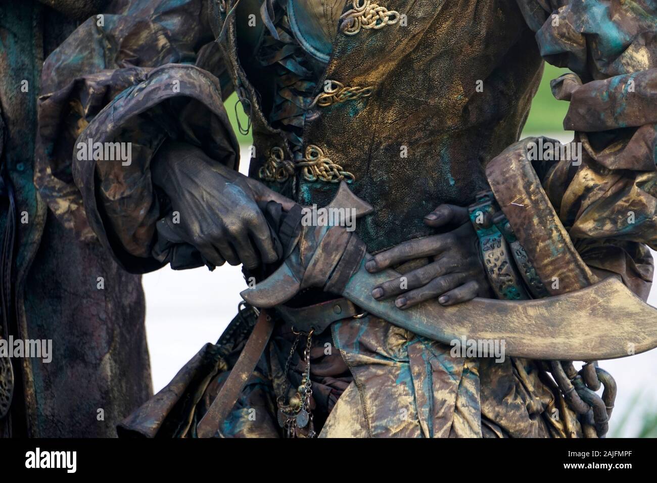 Details of Living statue of two pirates. Woman and man dressed in ...