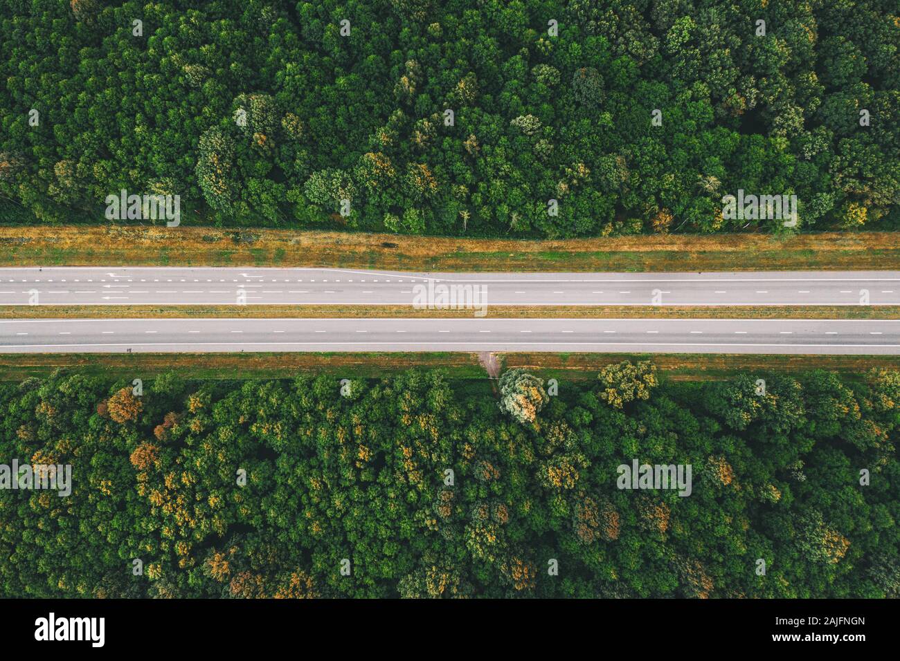 Aerial View Of Highway Road Through Green Forest Landscape In Summer ...