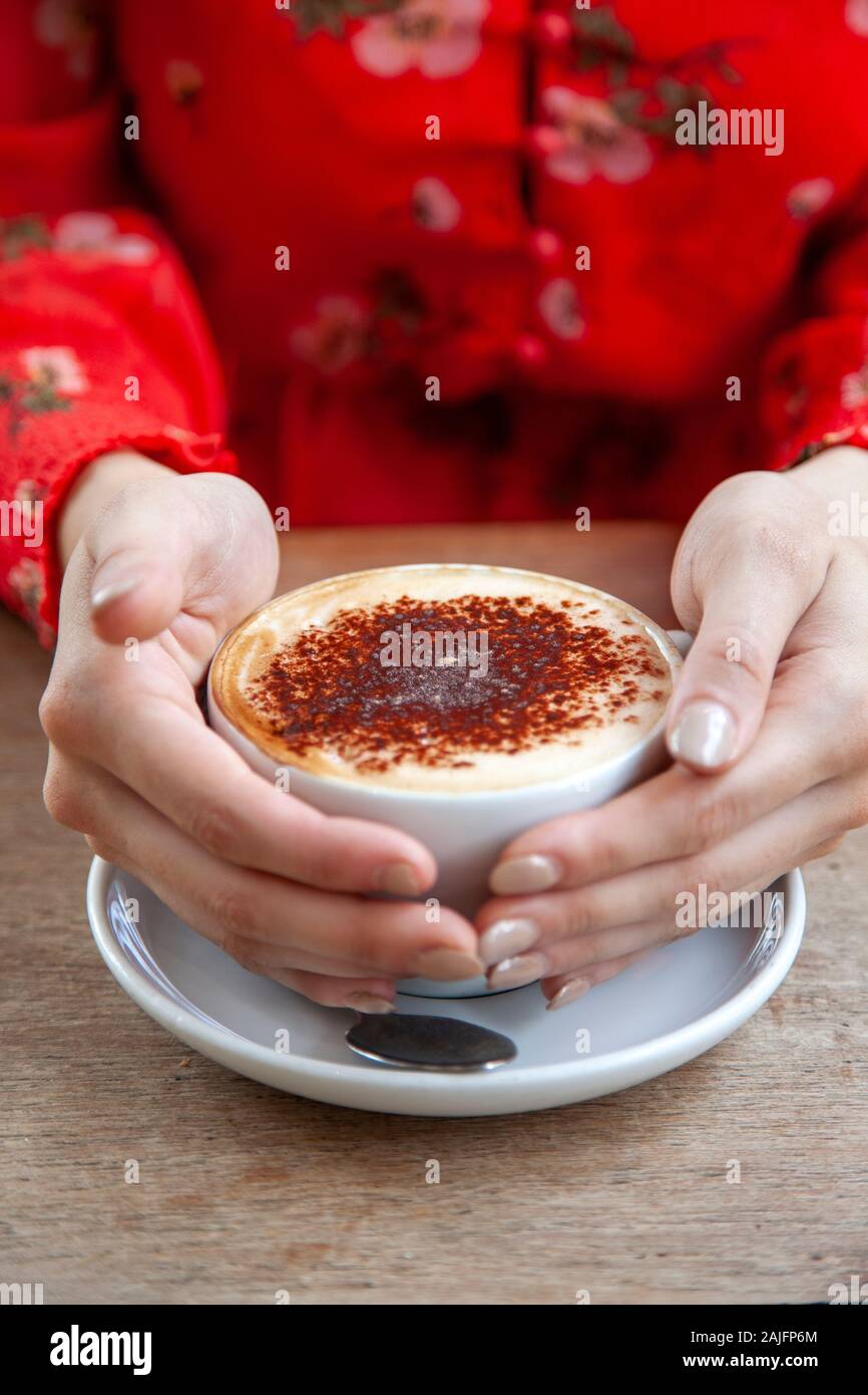 Hands around cup hi-res stock photography and images - Alamy