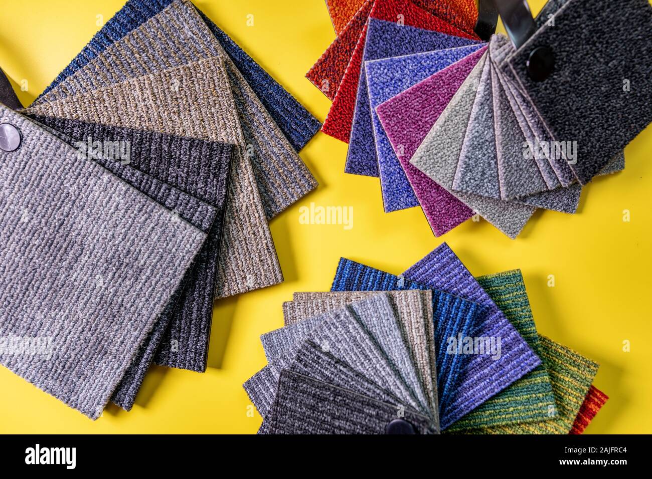 floor carpet samples on yellow background. top view Stock Photo - Alamy