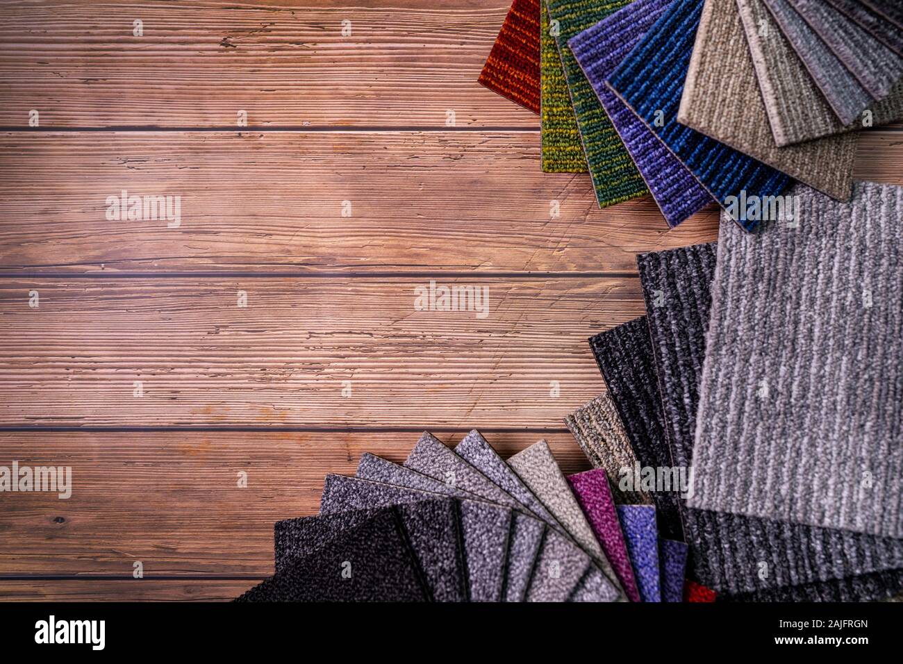 floor carpet samples on brown wooden background with copy space Stock ...