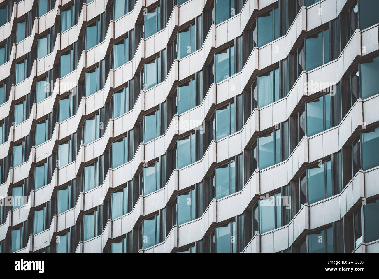 Irregular facade of an urban building creating a pattern Stock Photo ...