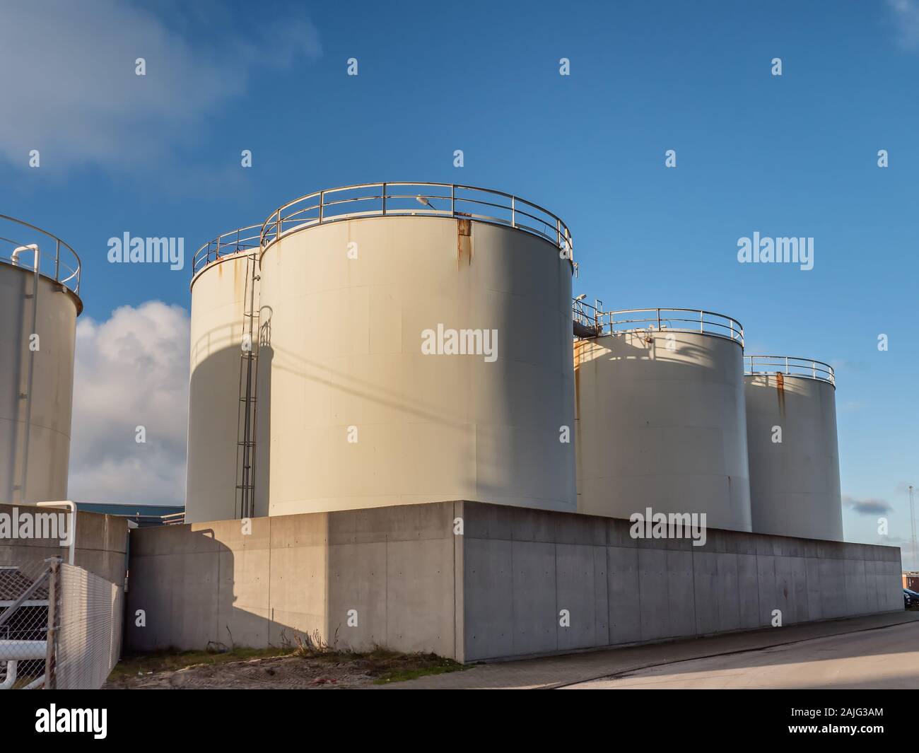 Fish oil tanks on Thyboroen harbor, Denmark Stock Photo - Alamy