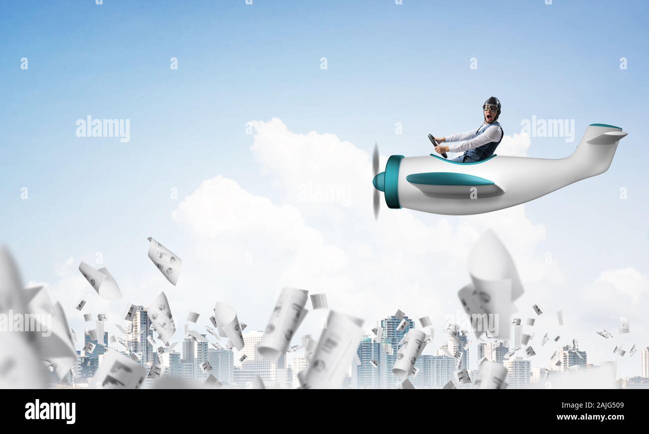 Screaming pilot sitting in cabin of small airplane. Happy man in ...