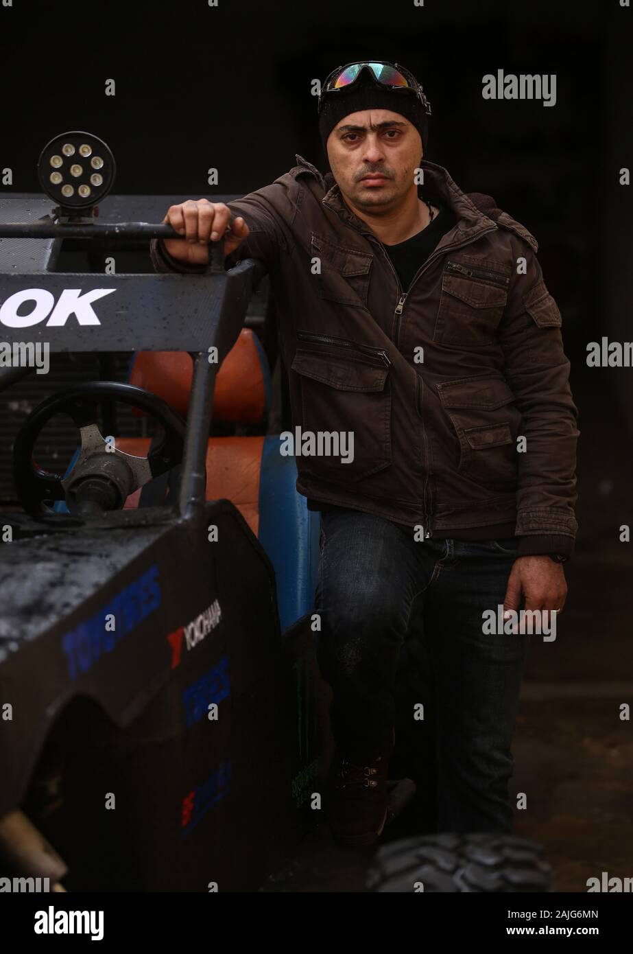 Gaza. 25th Dec, 2019. Mohammed al-Dabba poses for photos with his buggy ...