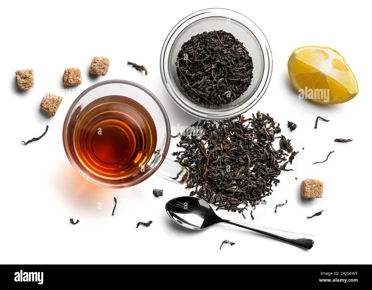 Black tea and accessories top view on white background Stock Photo - Alamy