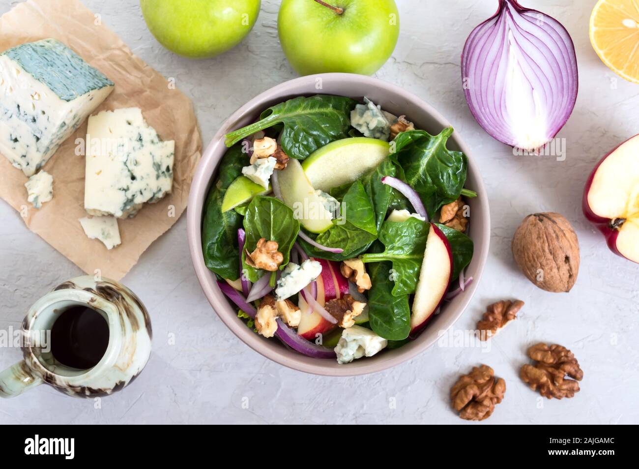 Delicious diet fitness salad with spinach, apples, red onions, blue ...