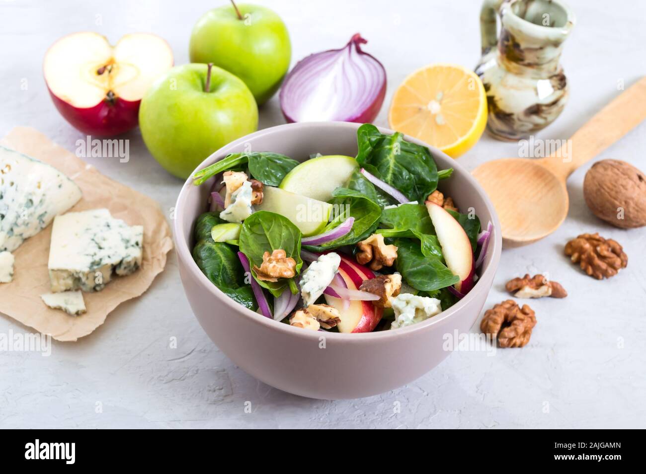 Delicious diet fitness salad with spinach, apples, red onions, blue ...