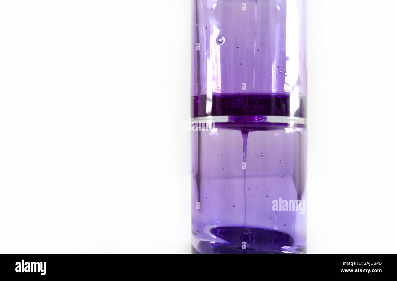 Purple lava lamp on white background Stock Photo - Alamy