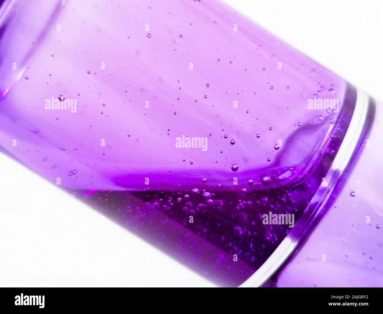 Close up of a purple lava lamp on white background Stock Photo - Alamy