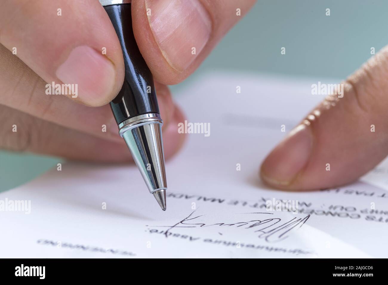 Doctor signing prescription on the prescription sheet Stock Photo - Alamy