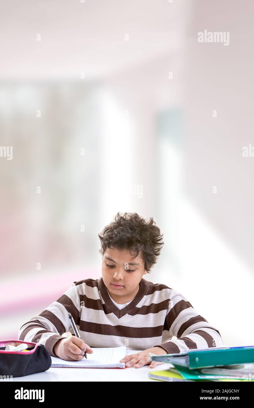 Young teen boy student doing homework at home Stock Photo - Alamy