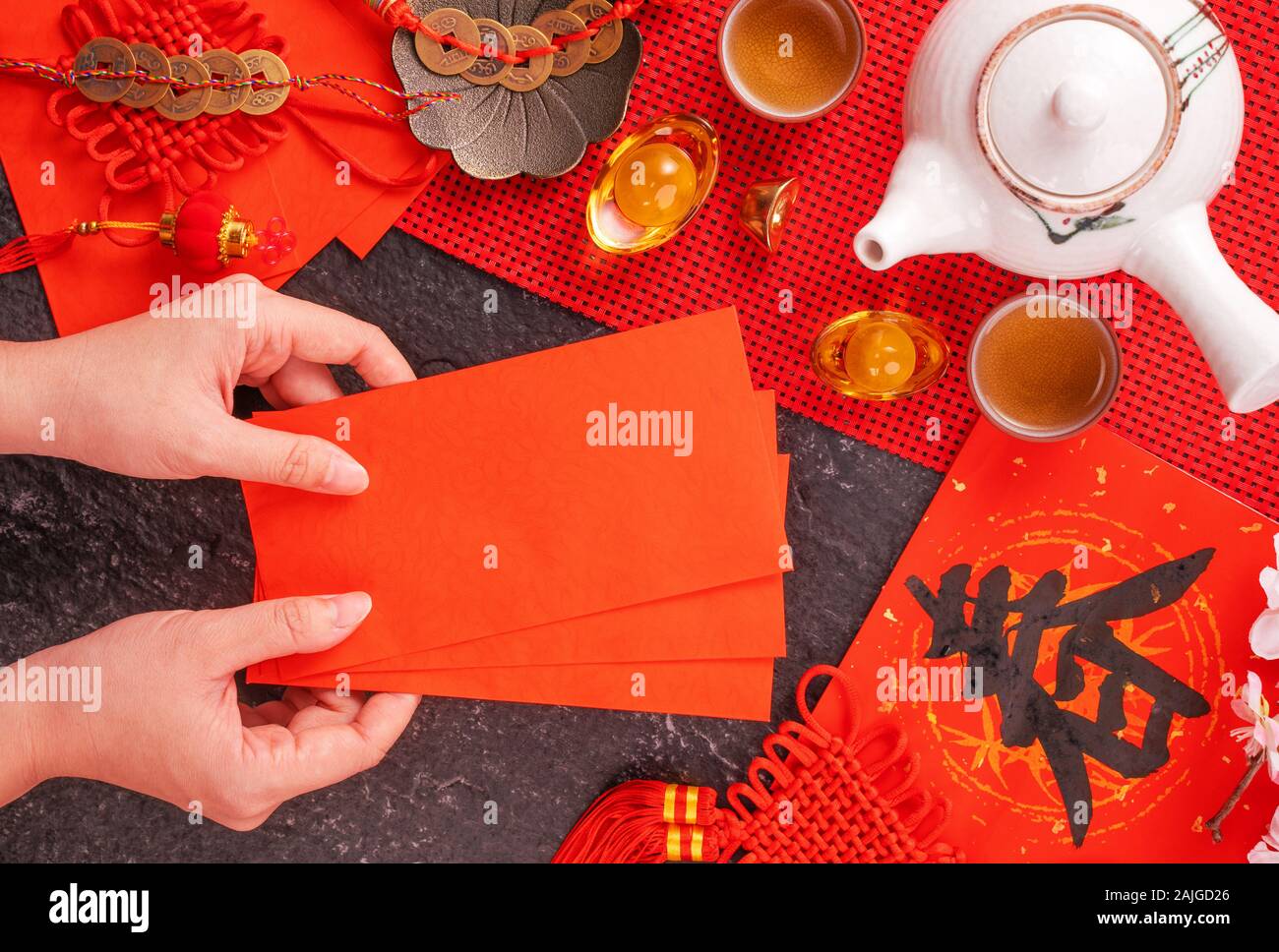 China lunar new year giving money hi-res stock photography and images ...