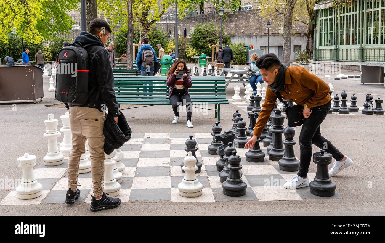 Geneva, Switzerland - April 16, 2019: People playing traditional ...