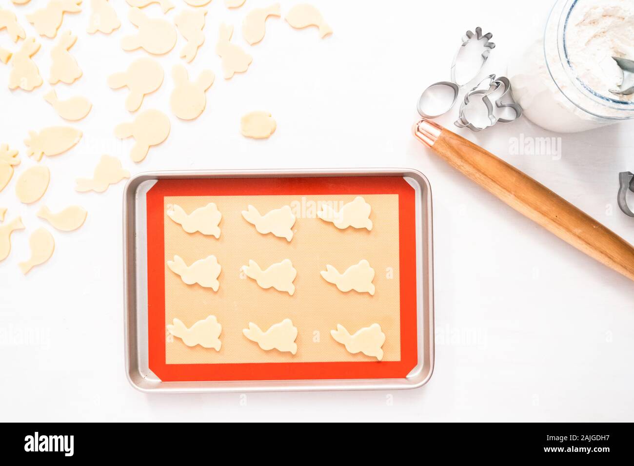 Flat lay. Unbaked sugar cookies on a baking sheet Stock Photo - Alamy