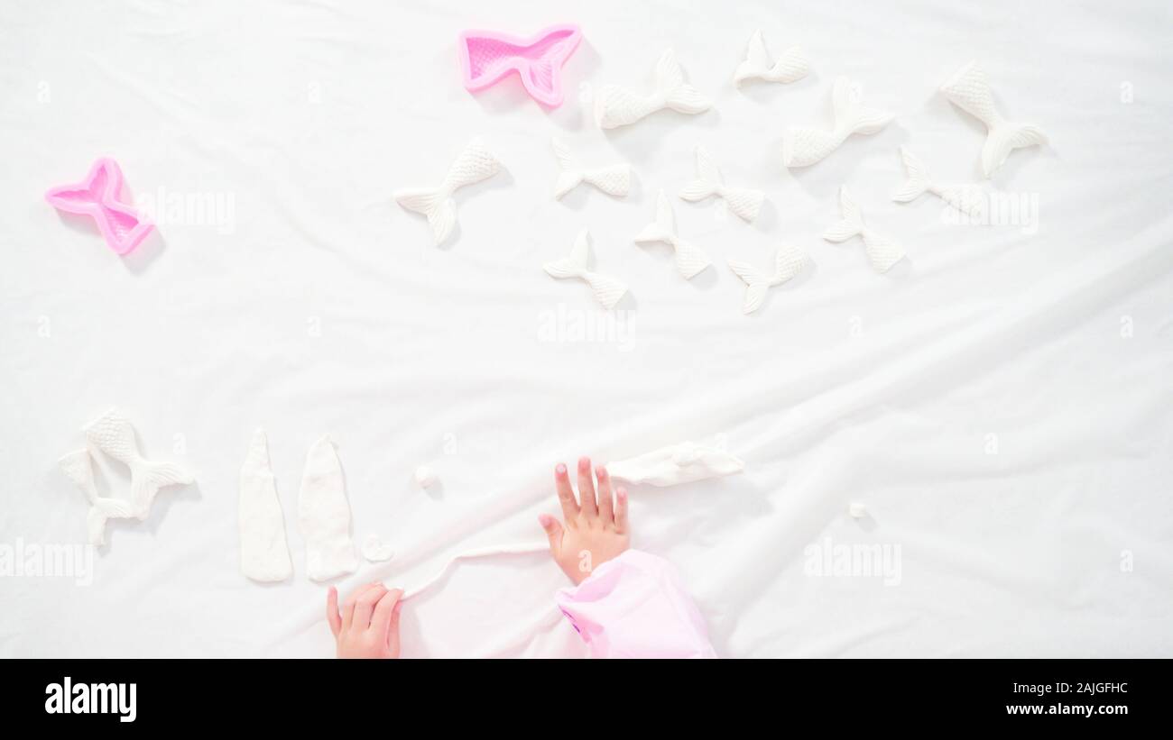 Flat lay. Step by step. Making mermaid tail from modeling clay in ...