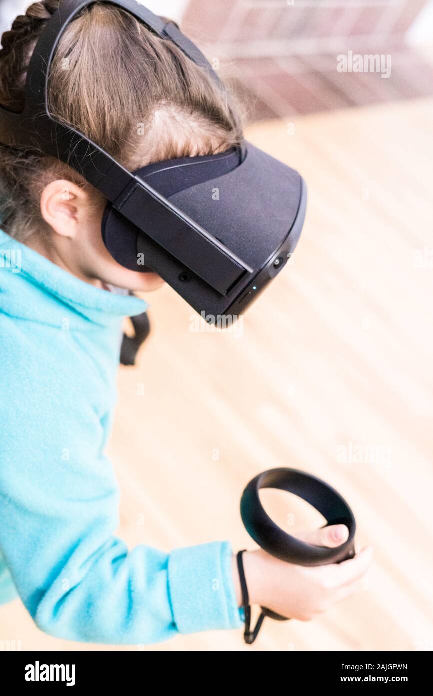 Little girl playing VR kids game in the living room Stock Photo - Alamy