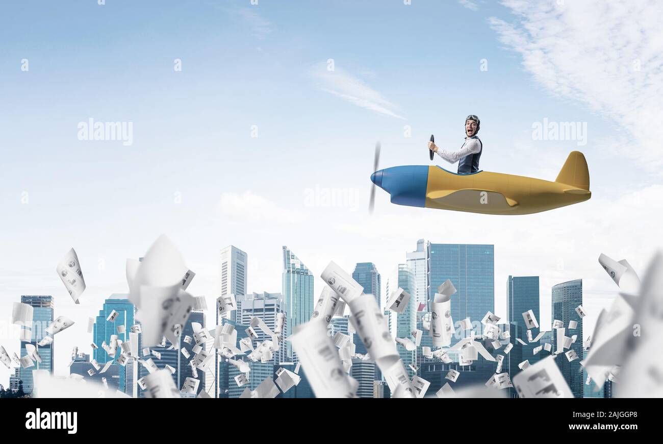 Satisfied emotional pilot sitting in cabin of small airplane. Happy man ...